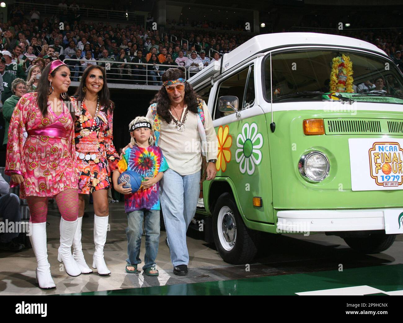Michigan State basketball coach Tom Izzo, right, enters the Breslin ...