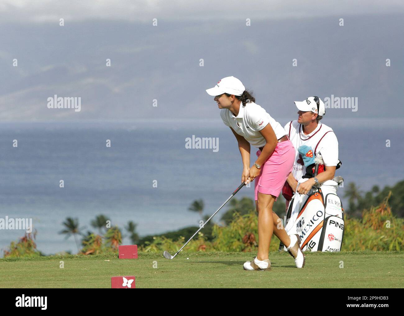 Lorena Ochoa, of Mexico, and her caddie Dave Brooker watch the flight of her shot on the 12th ...