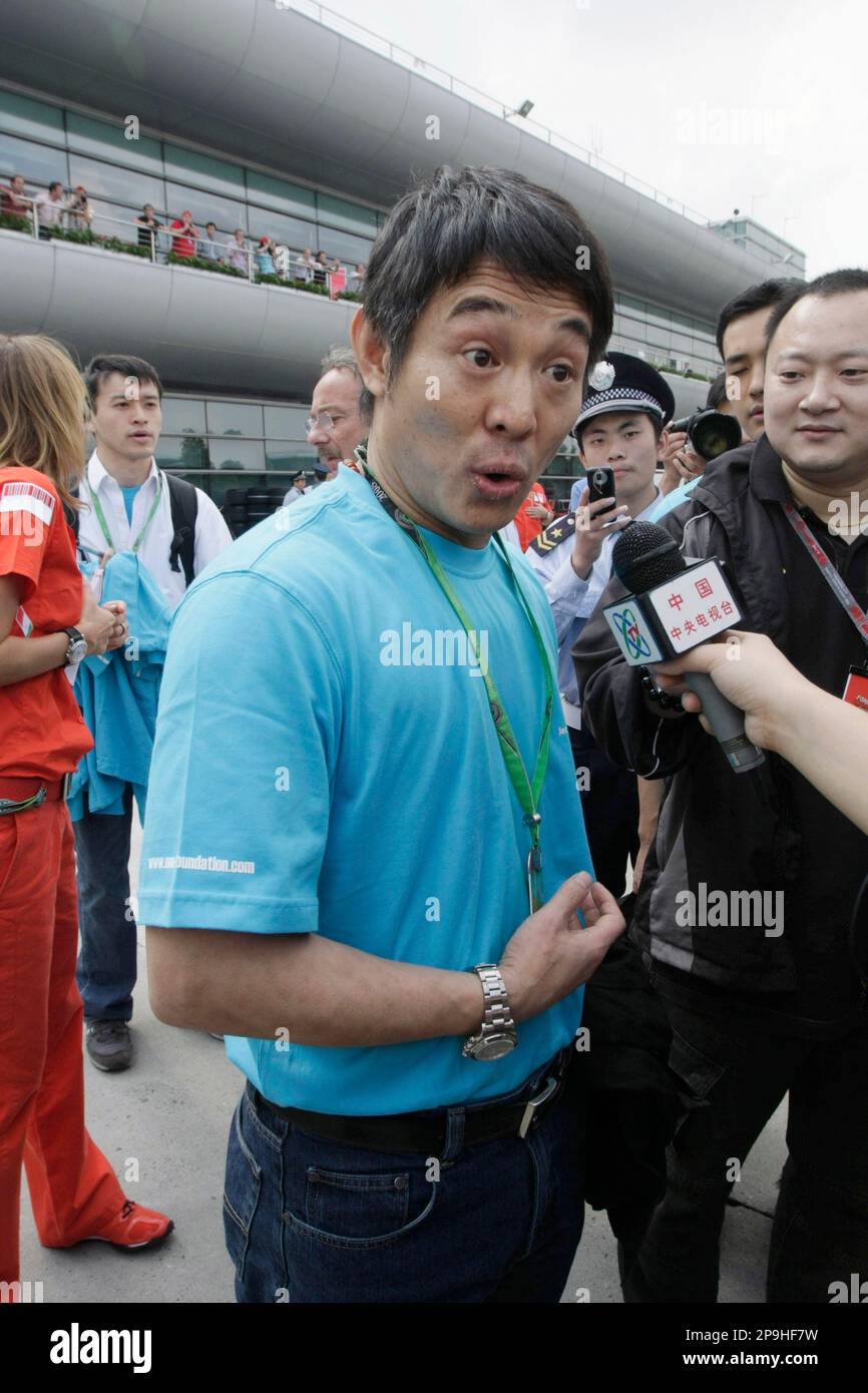Chinese actor Jet Li speaks to reporters upon his arrival at the ...