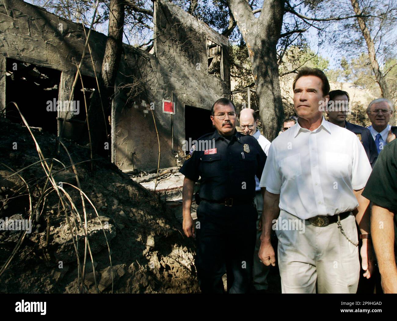 Ca. Fire Battalion Chief Jeff Millar shows Gov. Arnold Schwarzenegger ...