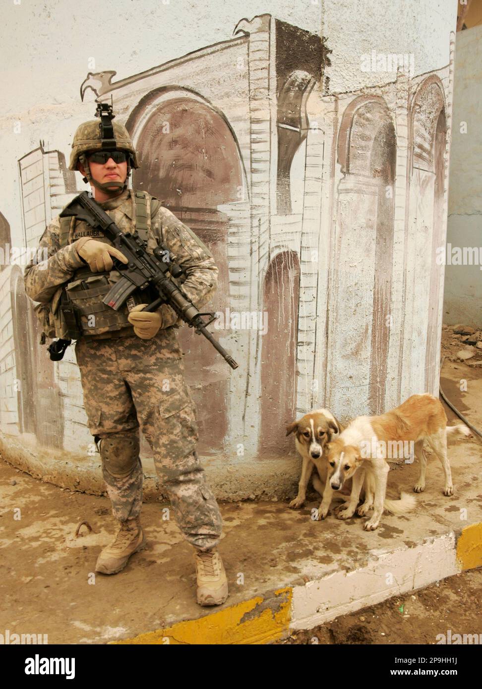 An American soldier stands guard during a routine patrol in the ...