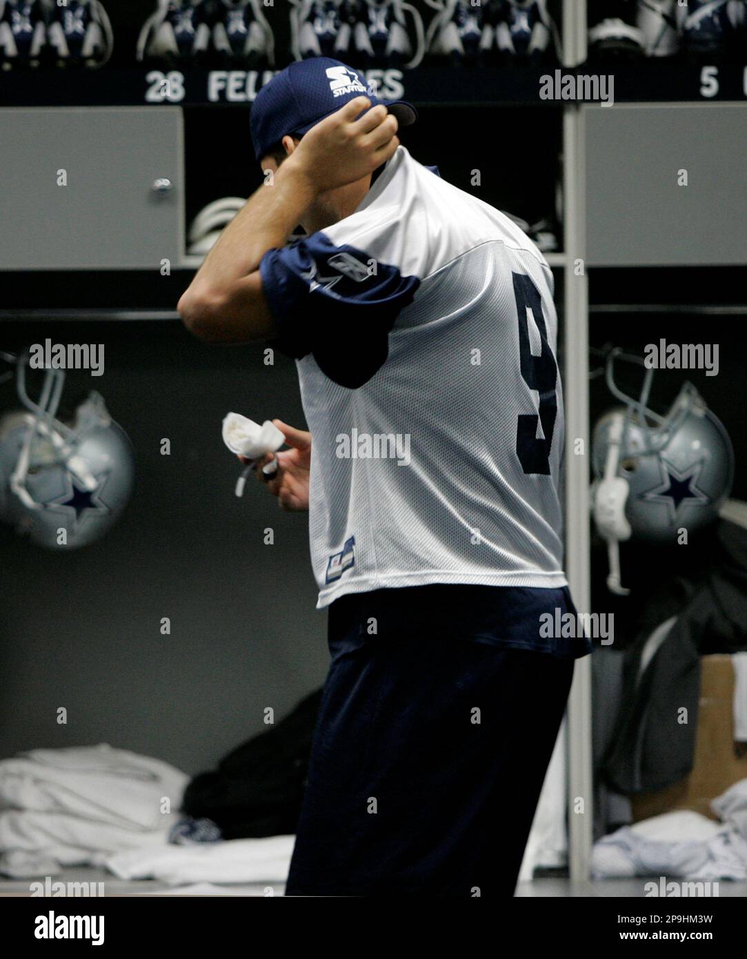 Dallas Cowboys quarterback Tony Romo (9) walks into the team's locker ...