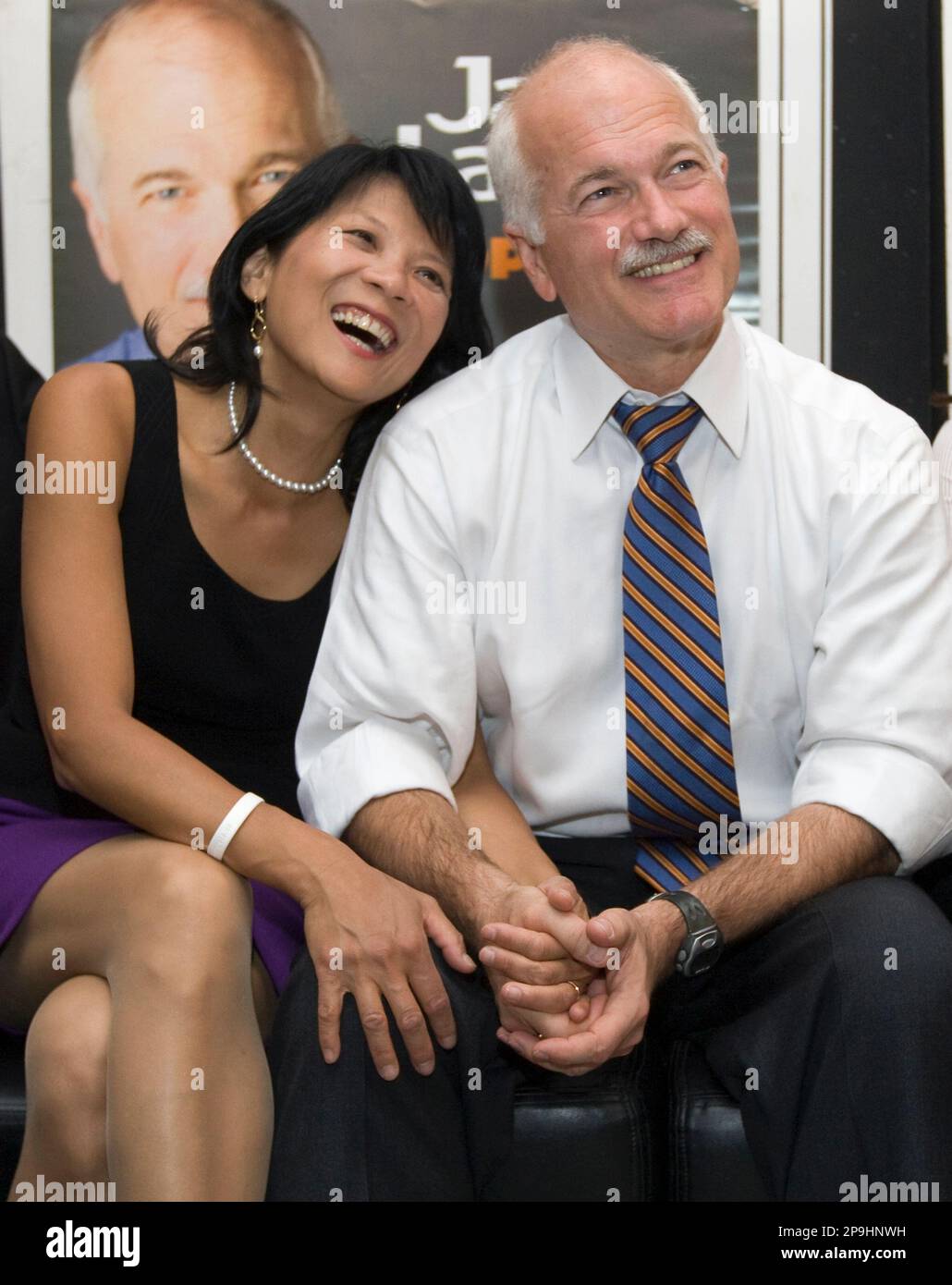 New Democratic Party Leader Jack Layton and his wife Member of Parliament Olivia Chow watch ...