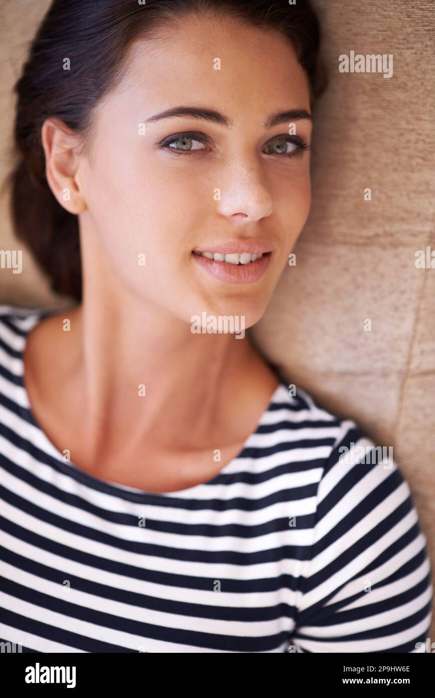 Perfectly natural and relaxed. Portrait of a beautiful young woman ...