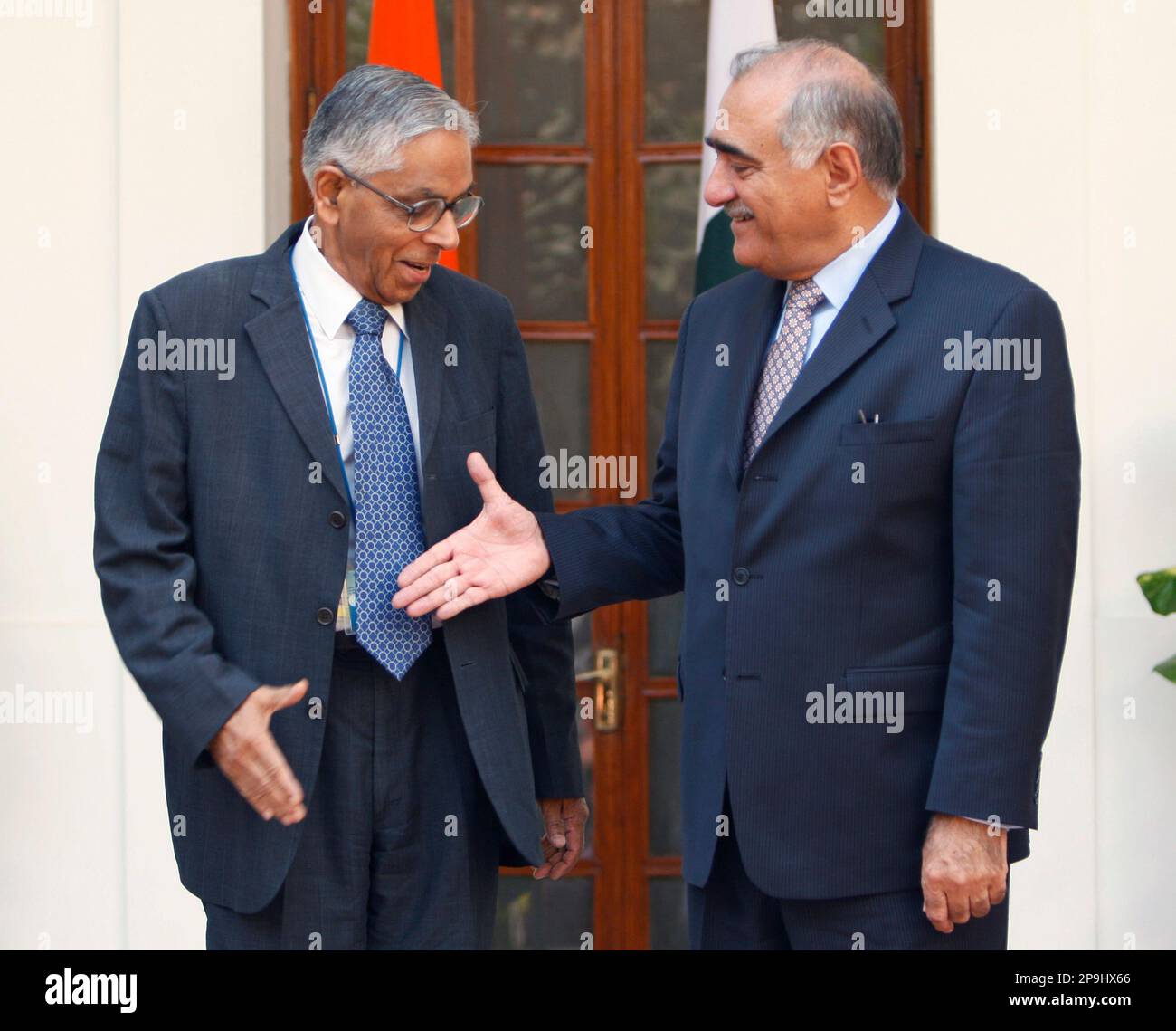 India's National Security Adviser M. K. Narayanan, left, is greeted by ...