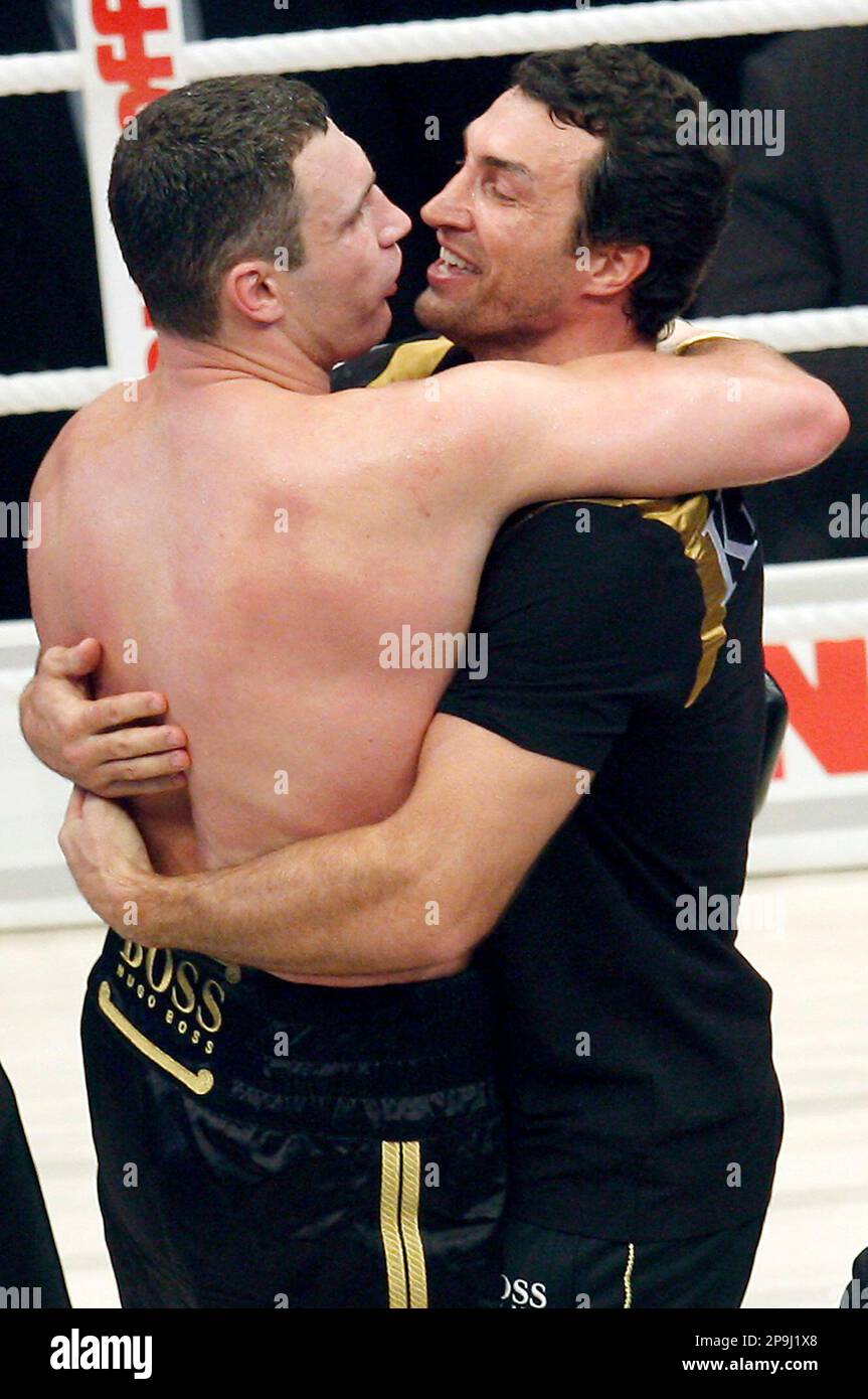 Vitali Klitschko, left, hugs his brother Wladimir Klitschko, right ...