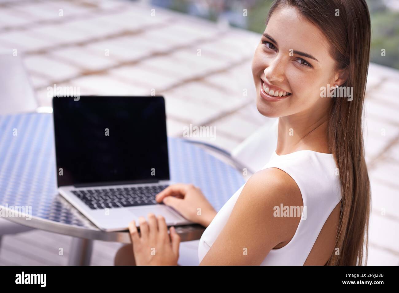 Keeping her business controlled from anywhere. a young woman working on ...