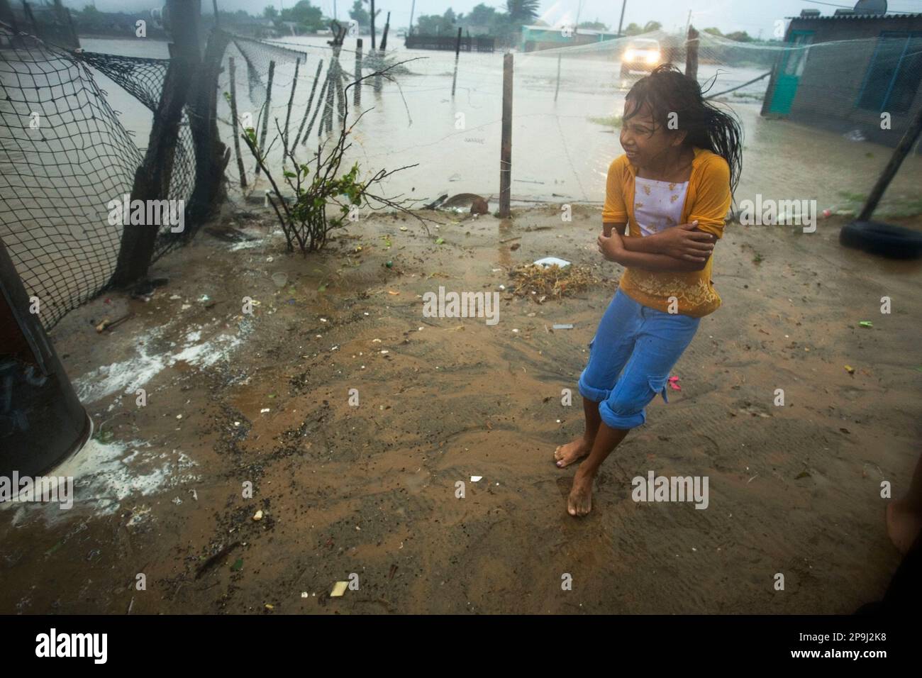 A girl struggles against winds during Hurricane Norbert in Puerto San ...