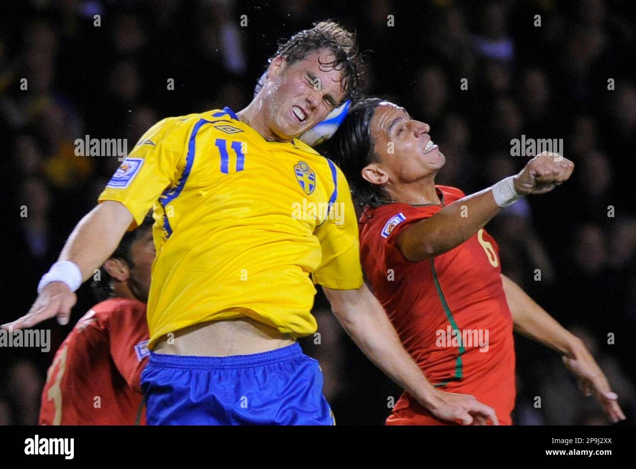 Sweden's Johan Elmander, left, and Portugal's Fernando Meira compete ...