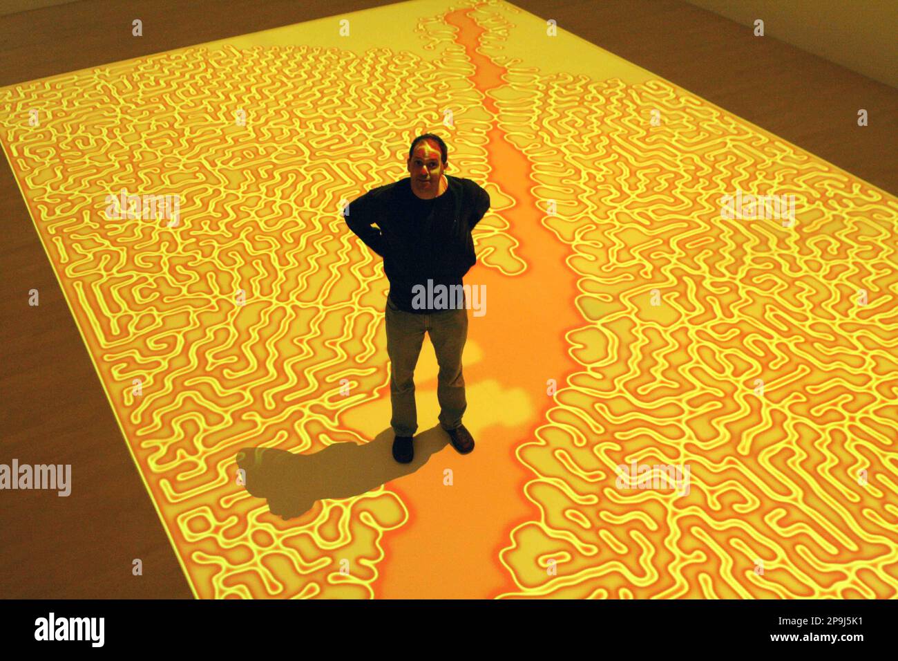 Artist Brian Knep stands in his "Healing Pool," which is part of "Act ...