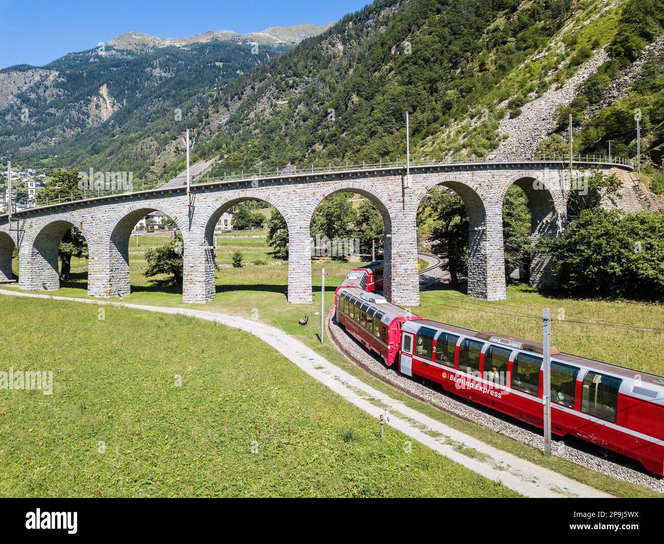 Brusio, Switzerland: 26 August 2018 - Bernina Express is going through ...