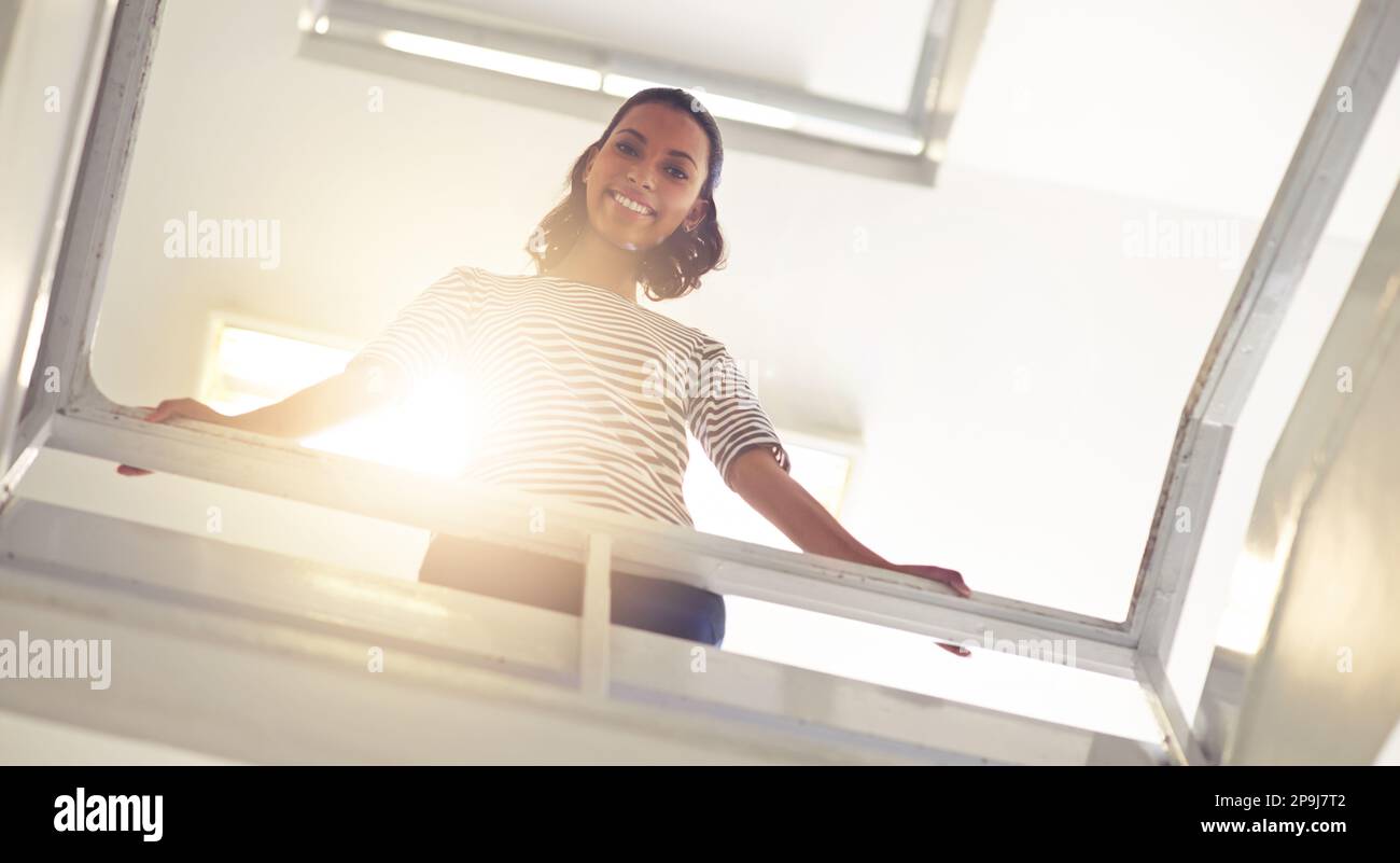 Another step up the ladder of success. Low angle portrait of a young ...