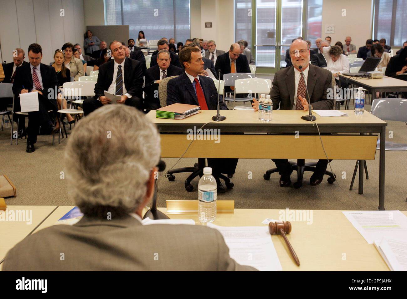 State senator Alan Lowenthal, foreground, listens as David Solow, chief ...