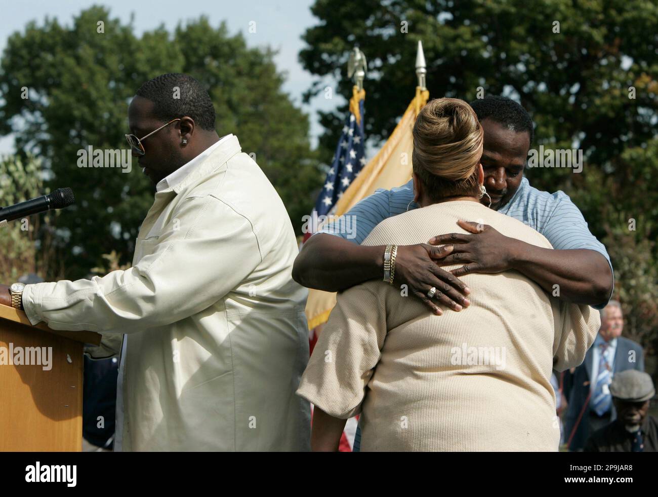 James Harvey, right, father of Dashon Harvey, hugs Shalga Hightower ...