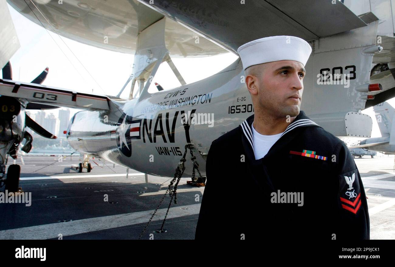 Petty Officer 2nd Class Carlos Gomez from New Jersey, a crew member of ...