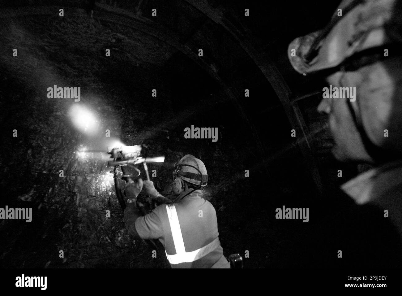 ** ADVANCE FOR MONDAY, OCT. 13 ** Miners work on the coal face some ...