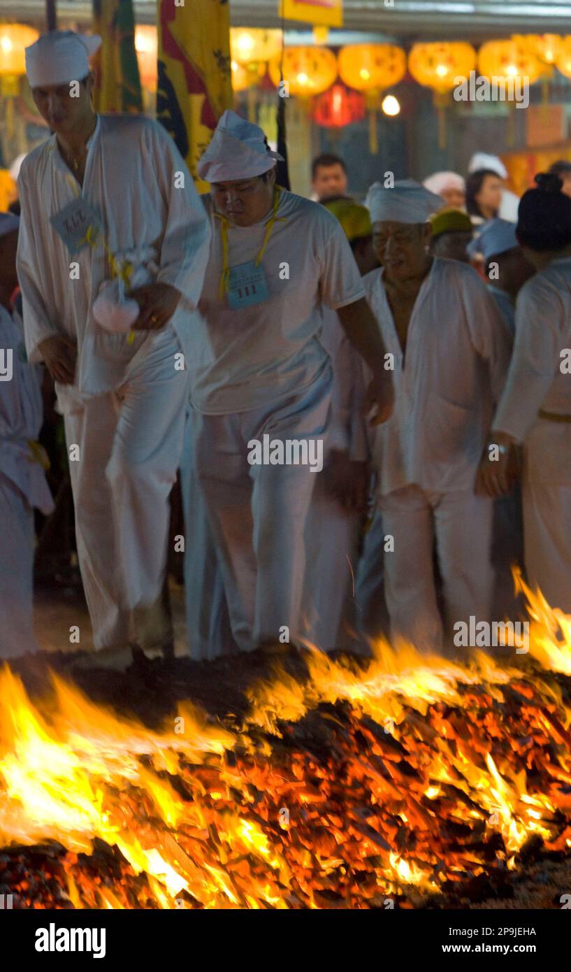 Malaysian ethnic Chinese walk barefoot over burning coals on the final ...