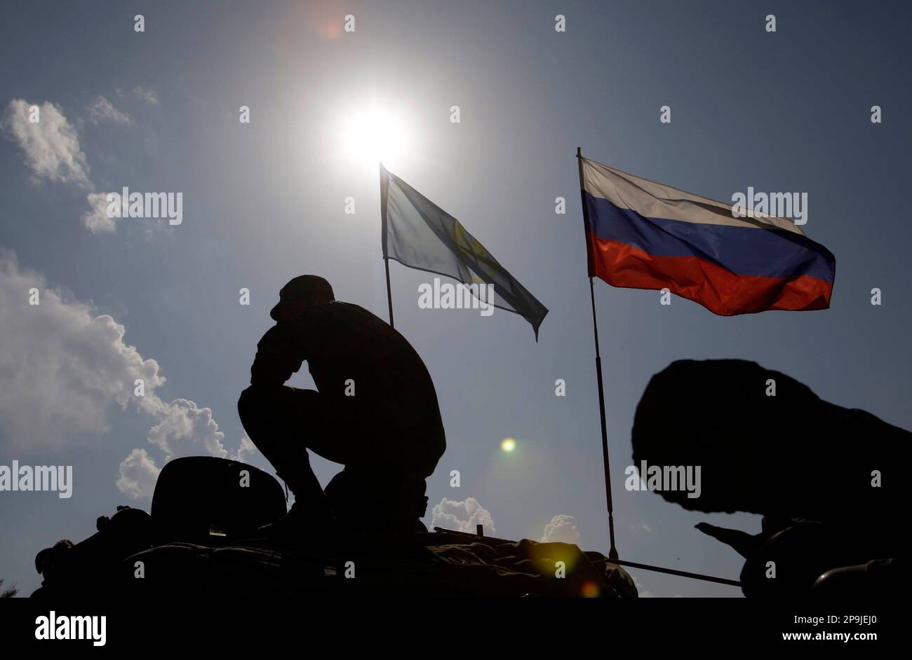 Russian soldier seen atop an armoured vehicle at a Russian checkpoint ...