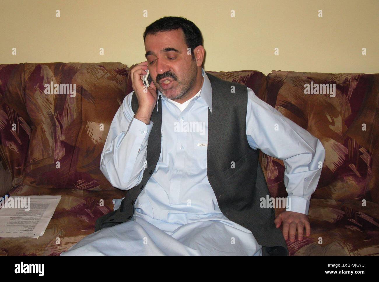 Ahmed Wali Karzai, brother of Afghan President Hamid Karzai, talks on ...