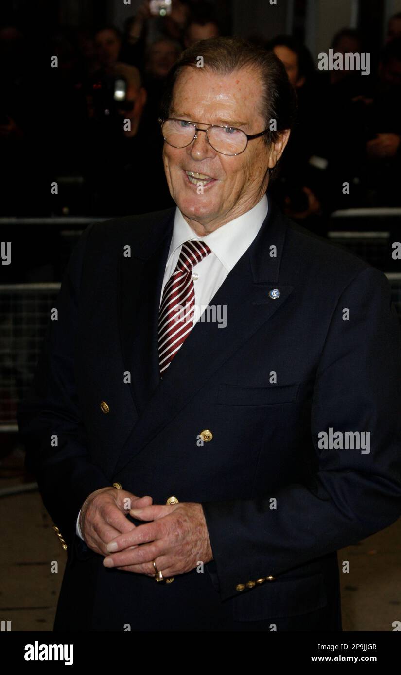 British actor Roger Moore arrives for the Story Of James Bond evening ...