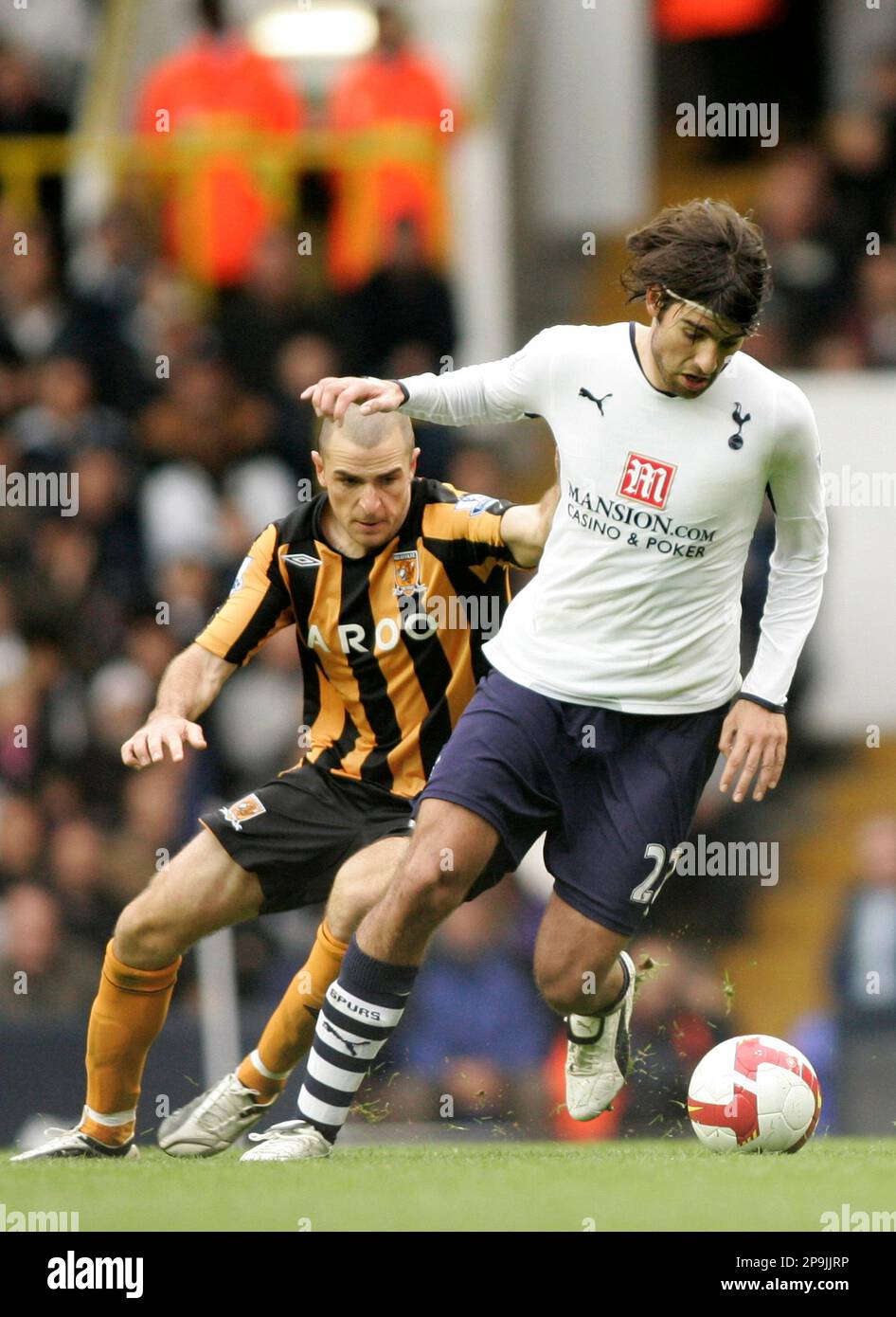 Tottenham Hotspur's Vedran Corluka, right, competes with Hull City's ...