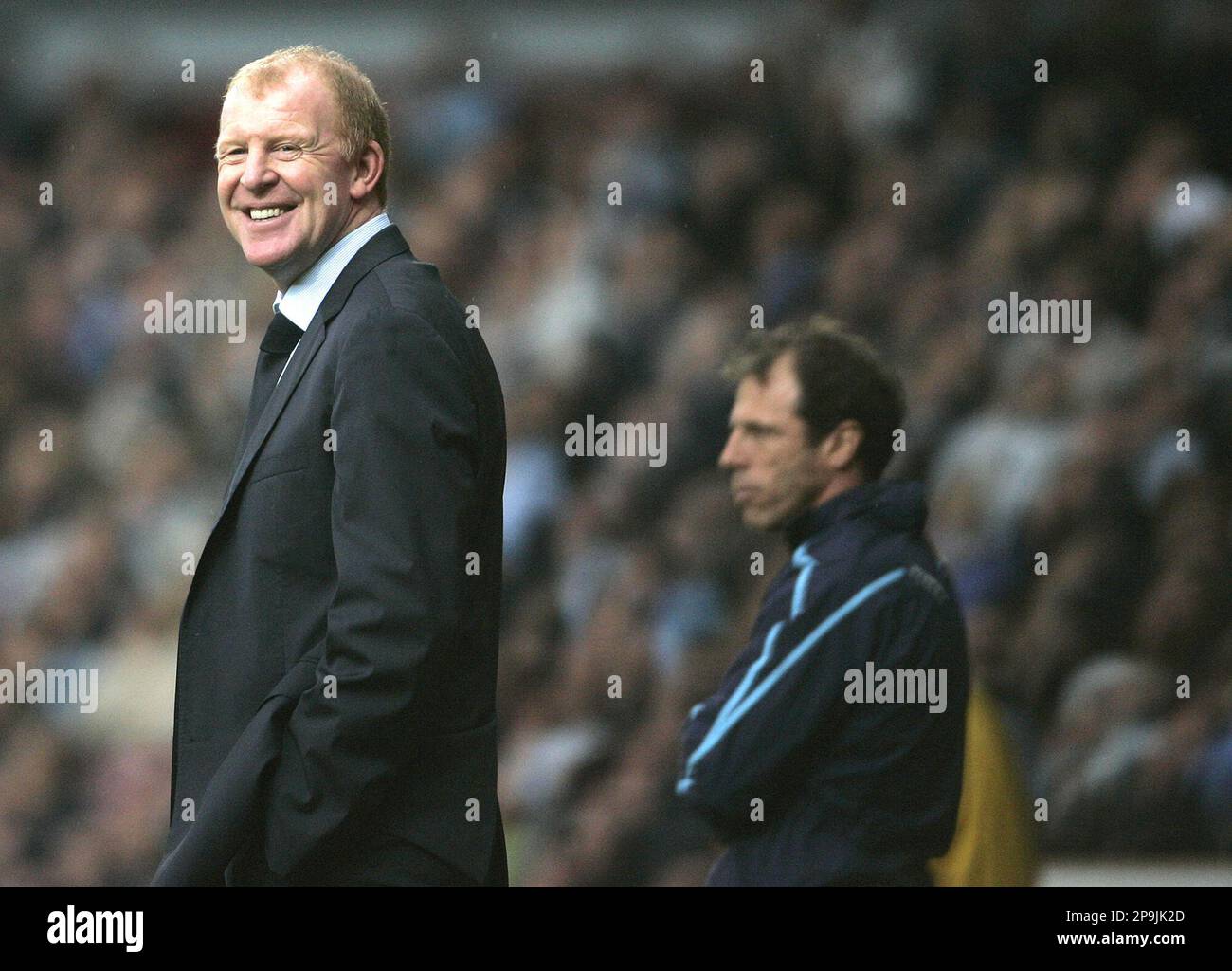 Bolton Wanderers' manager Gary Megson, left, smiles as West Ham United ...