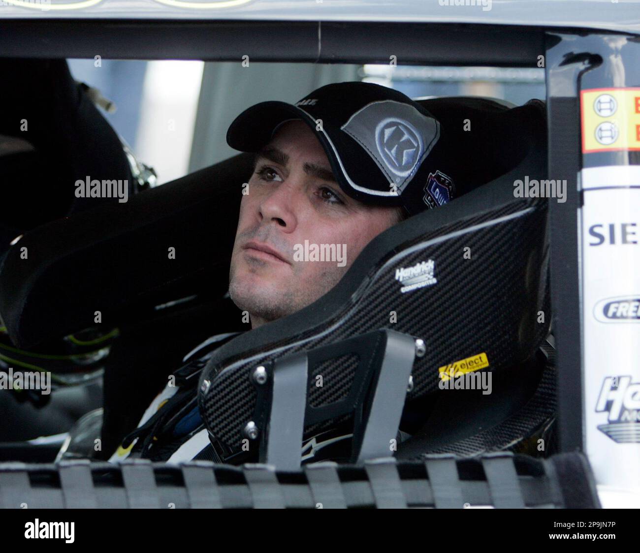 NASCAR driver Jimmie Johnson sits in his car after qualifying for ...