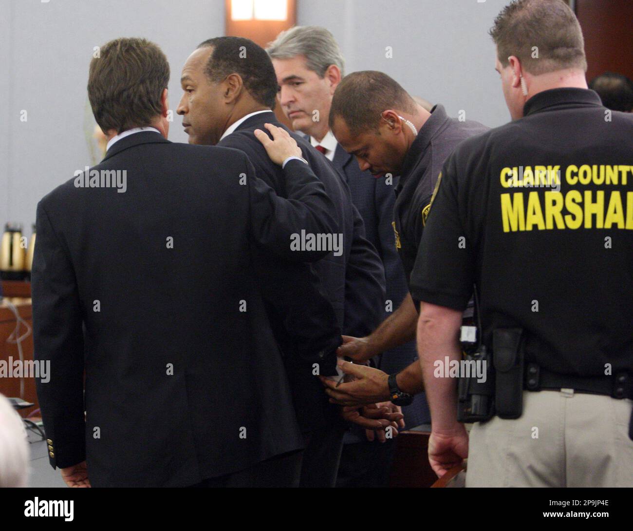 O.J. Simpson is handcuffed after a verdict of guilty on all counts was ...