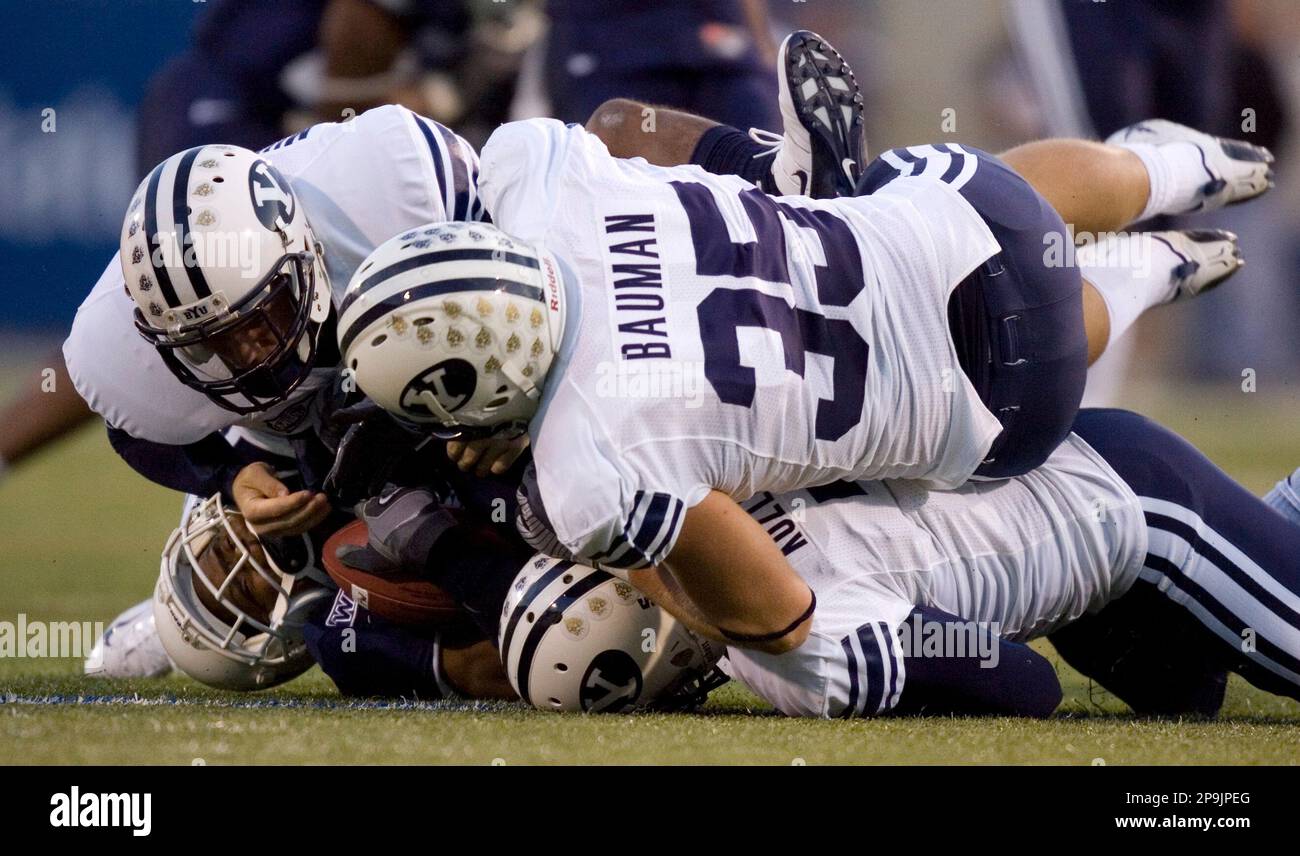 Utah State's Kejon Murphy (1) is covered by BYU players Spencer Hadley ...