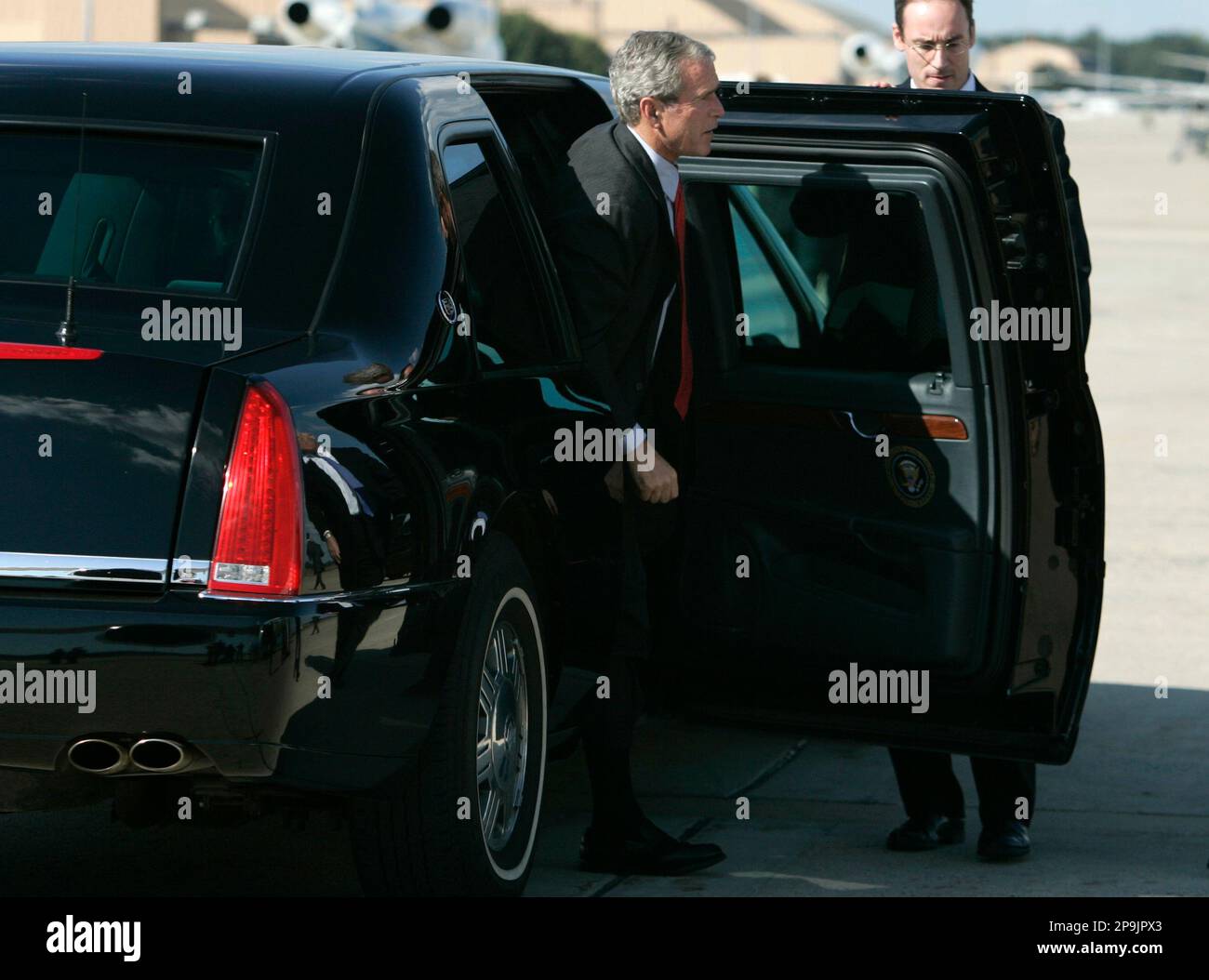 President Bush steps out of his limo before boarding Air Force One on ...