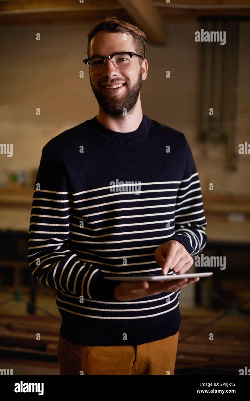Using touchscreen technology. a hipster using a touchscreen device ...