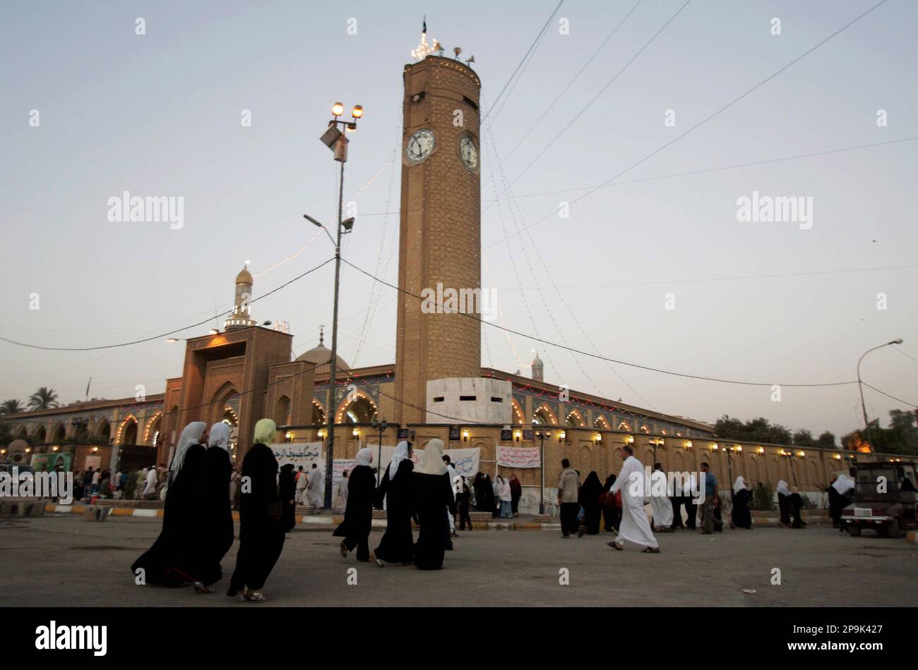 Iraqi Sunni Muslims arrive for prayers at Abu Hanifa mosque in central ...