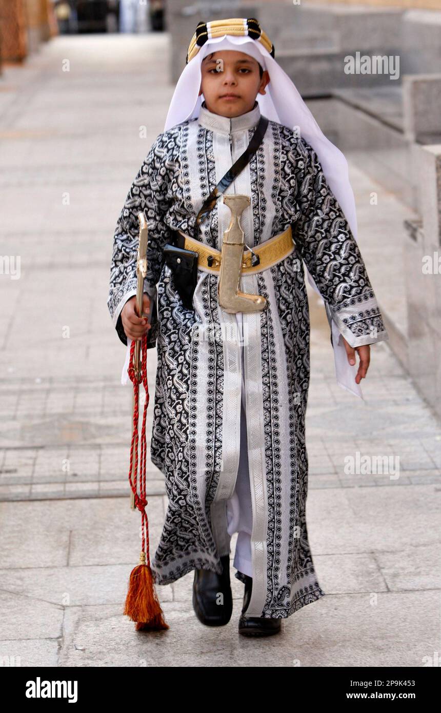 A Saudi child wearing traditional clothes arrives to the Imam Turki bin ...