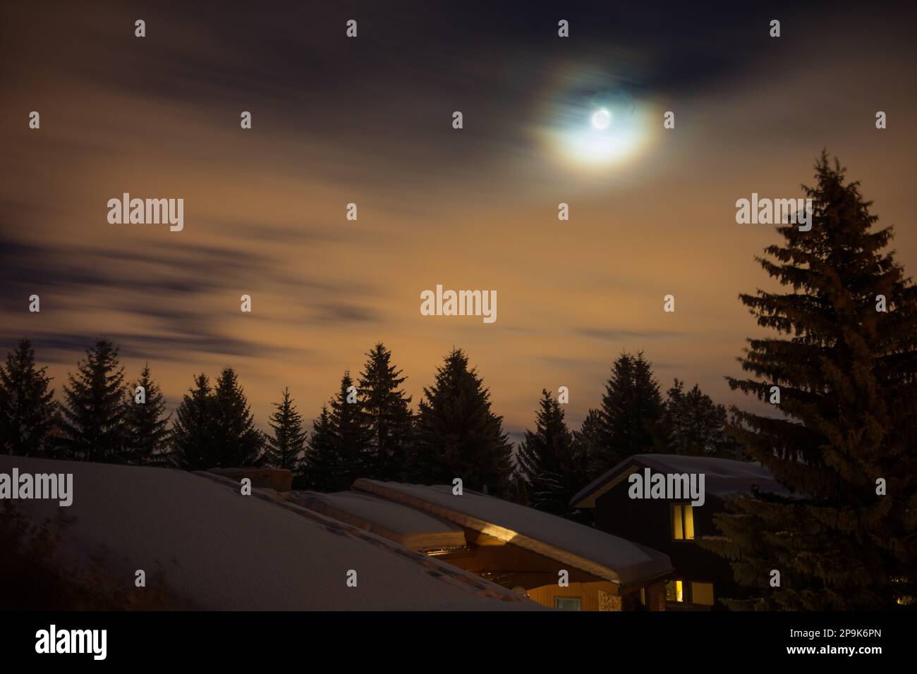 Moon and house lights night cityscape Stock Photo - Alamy