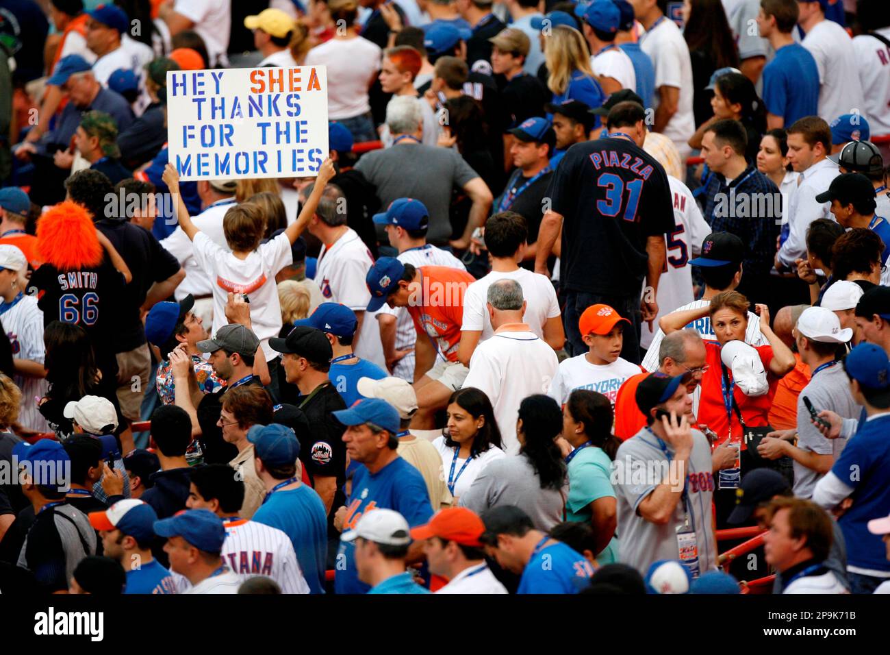 A fan holds up a sign after the New York Mets' last baseball game in ...