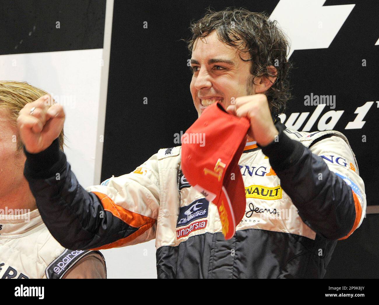 Renault Formula One driver Fernando Alonso of Spain celebrates after he ...