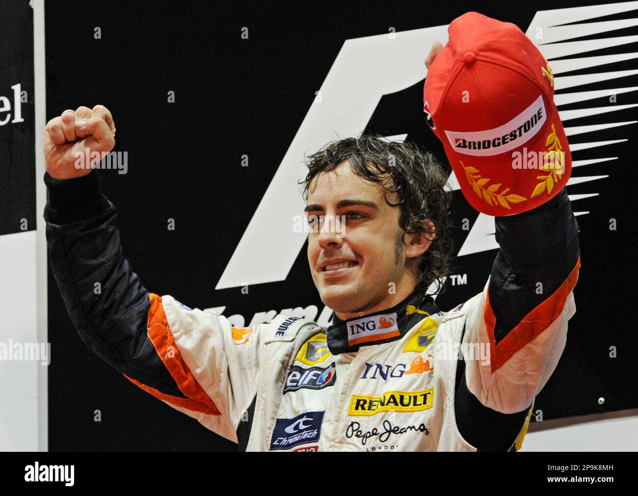 Renault Formula One driver Fernando Alonso of Spain celebrates after he ...