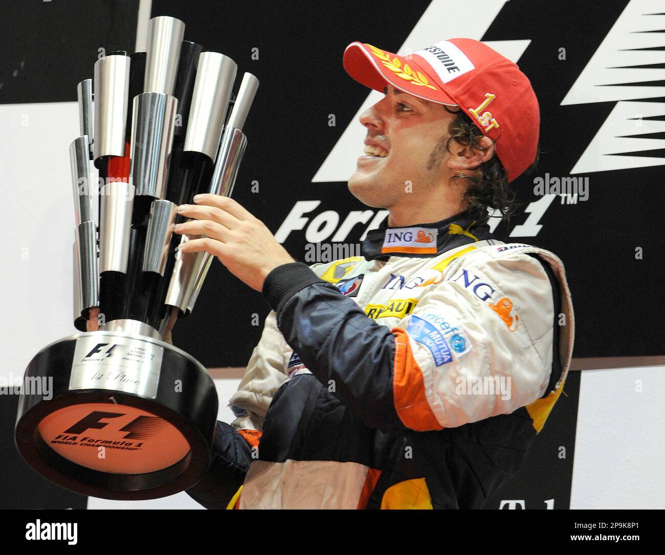 Renault Formula One driver Fernando Alonso of Spain celebrates after he ...