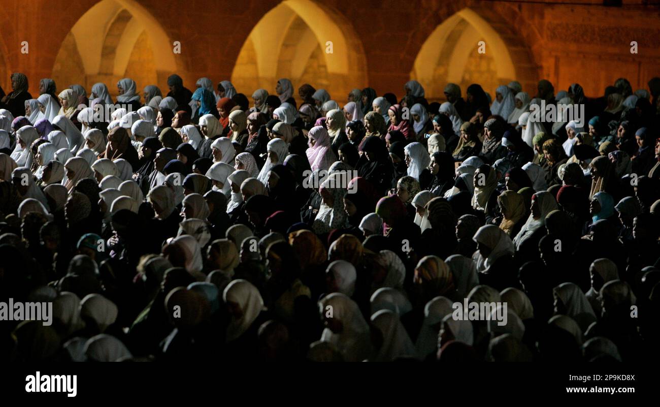 Palestinian Muslim worshipers pray during Lilat al-Qader, also known as ...