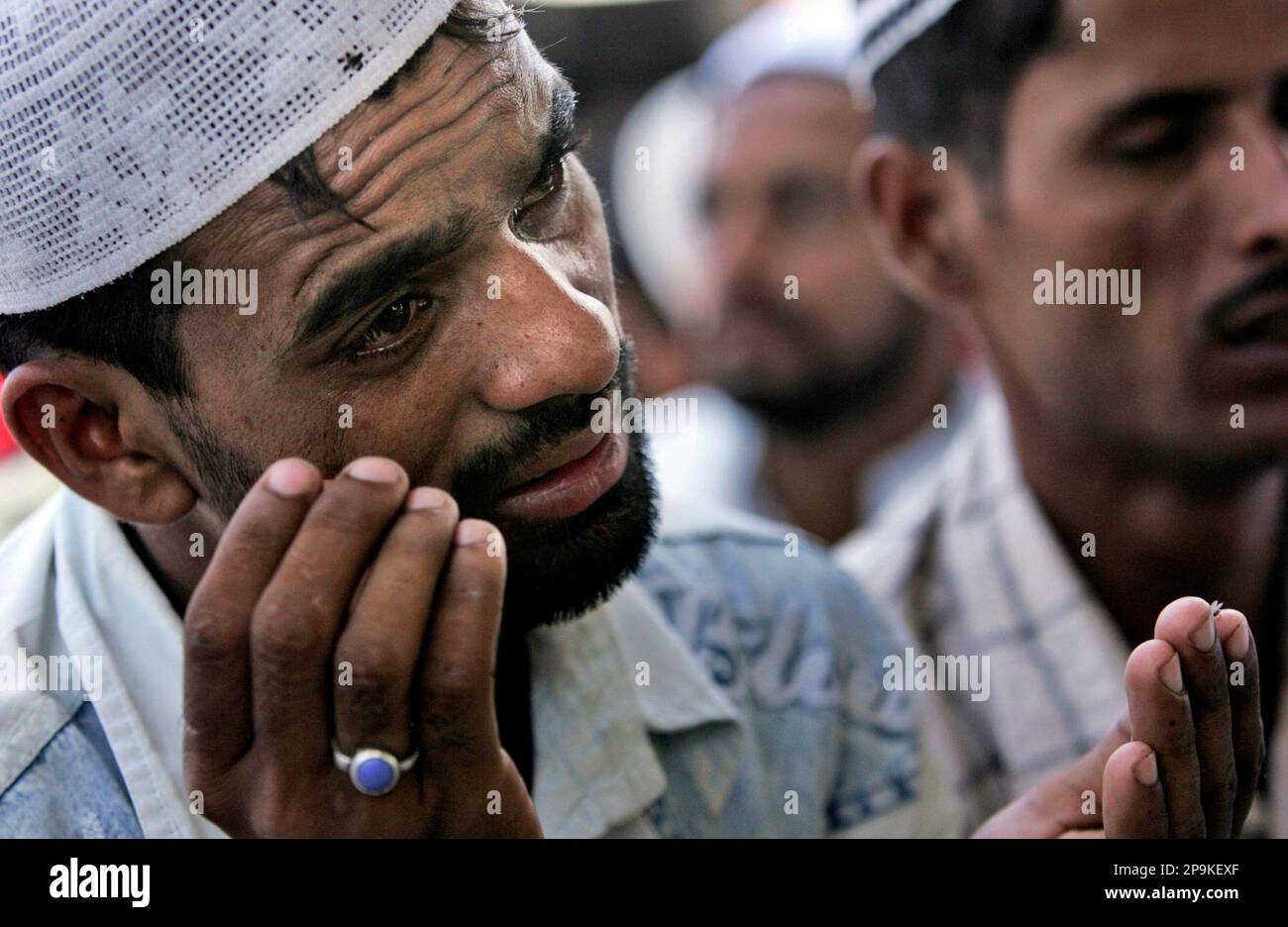 A Muslim cries as he listens to the high priest talking about the ...
