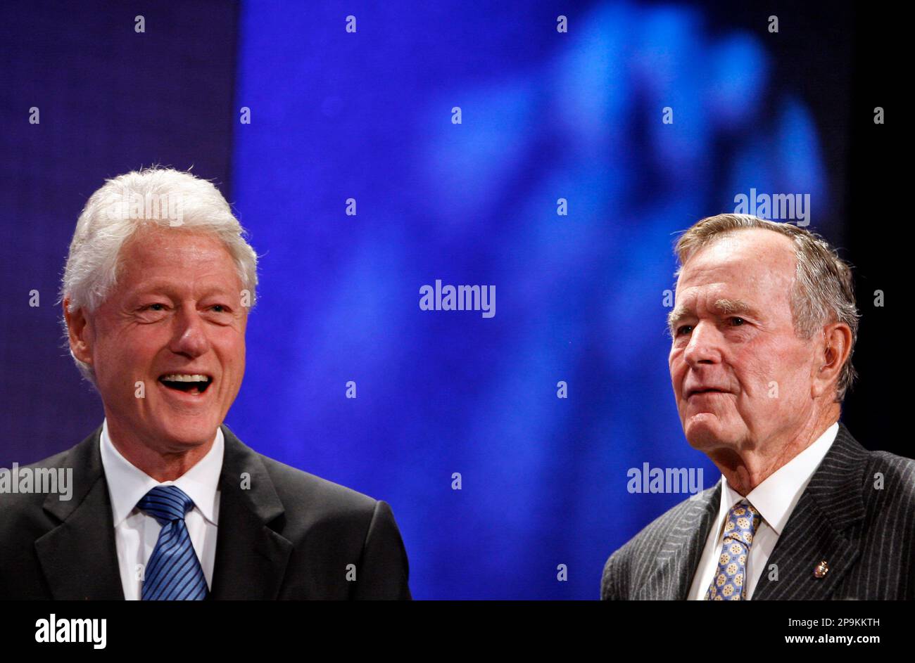 Former Presidents Bill Clinton, left, and George H.W. Bush appear ...
