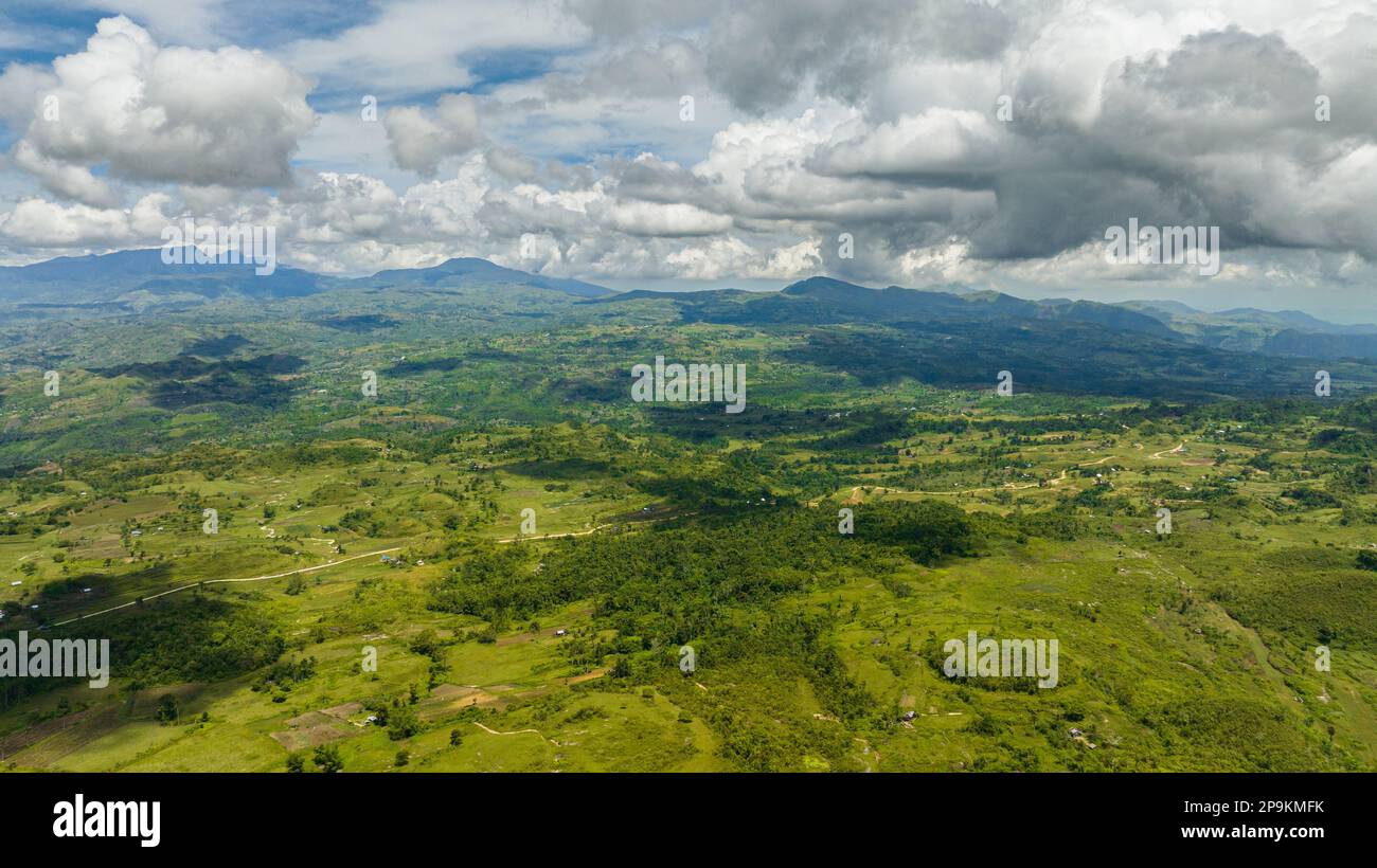 Aerial view of mountain landscape with green hills and farmland. Negros ...
