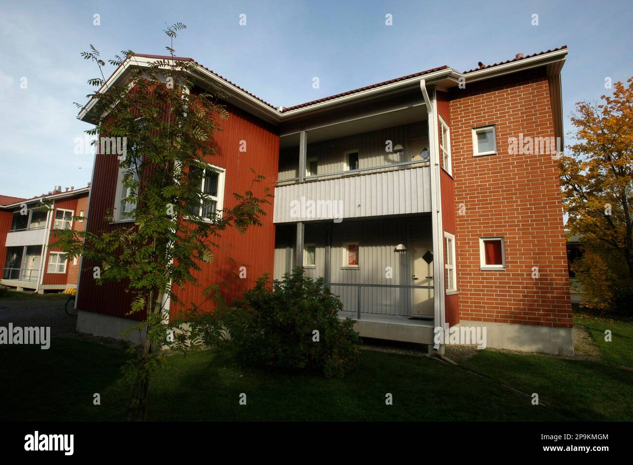 Police tape seals the door of the flat, top right, of gunman Matti ...