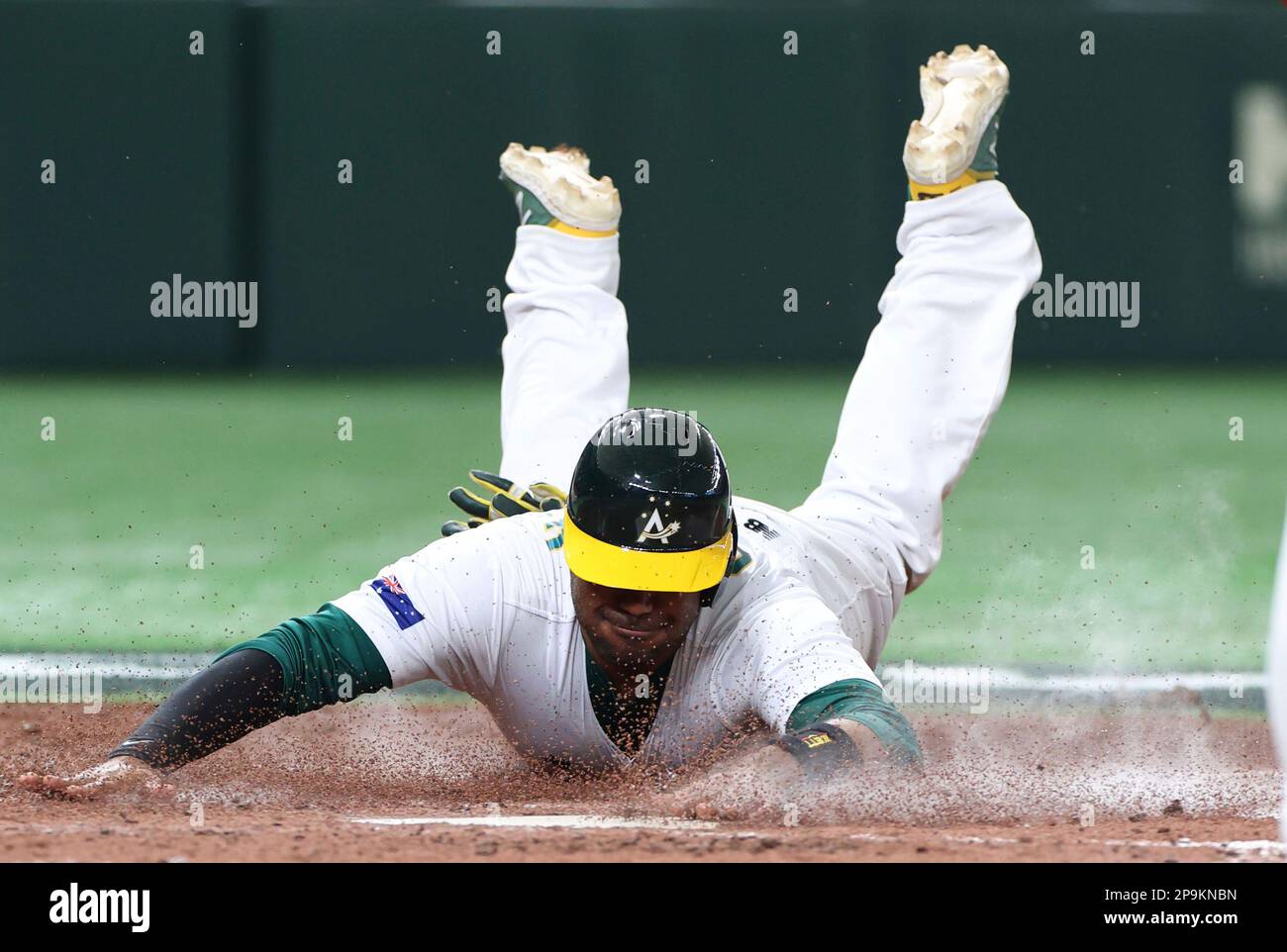 Australian Darryl Roy George heads a slide to score during the 4th ...