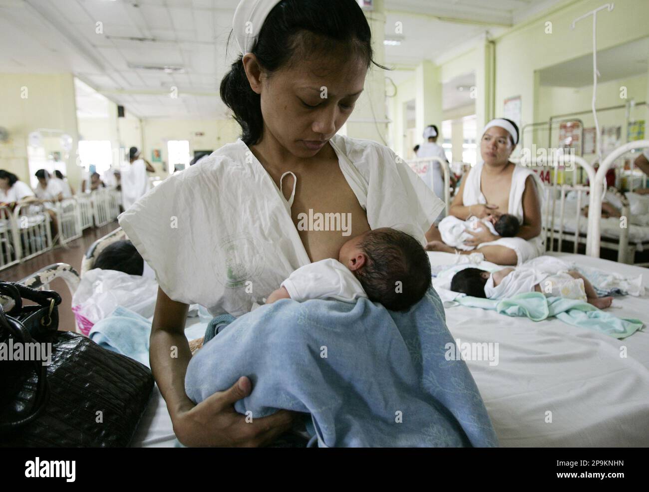 Nursing Filipino mothers breasfeed their babies at the Fabella Memorial ...