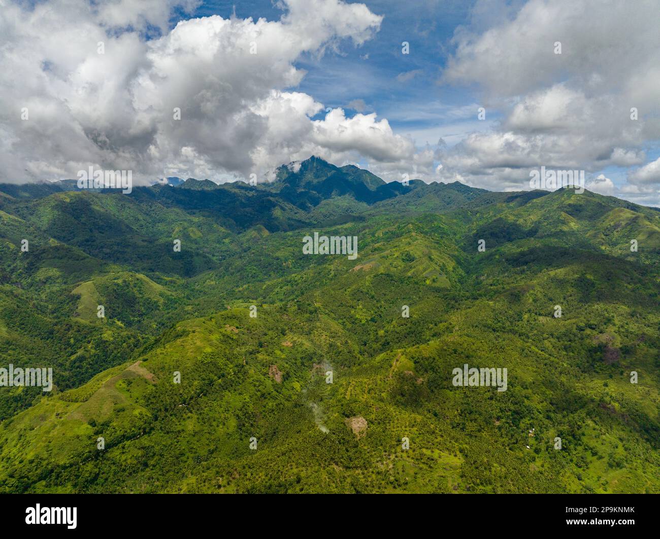 Tropical mountain range and mountain slopes with rainforest ...
