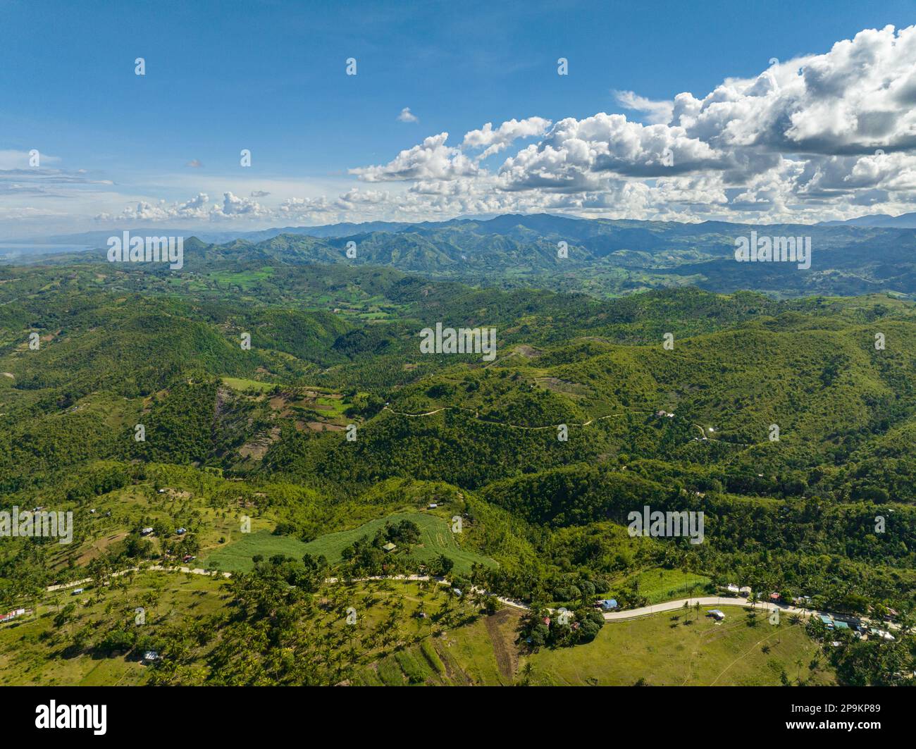 Aerial view of farmland on the slopes of hills in the mountainous ...