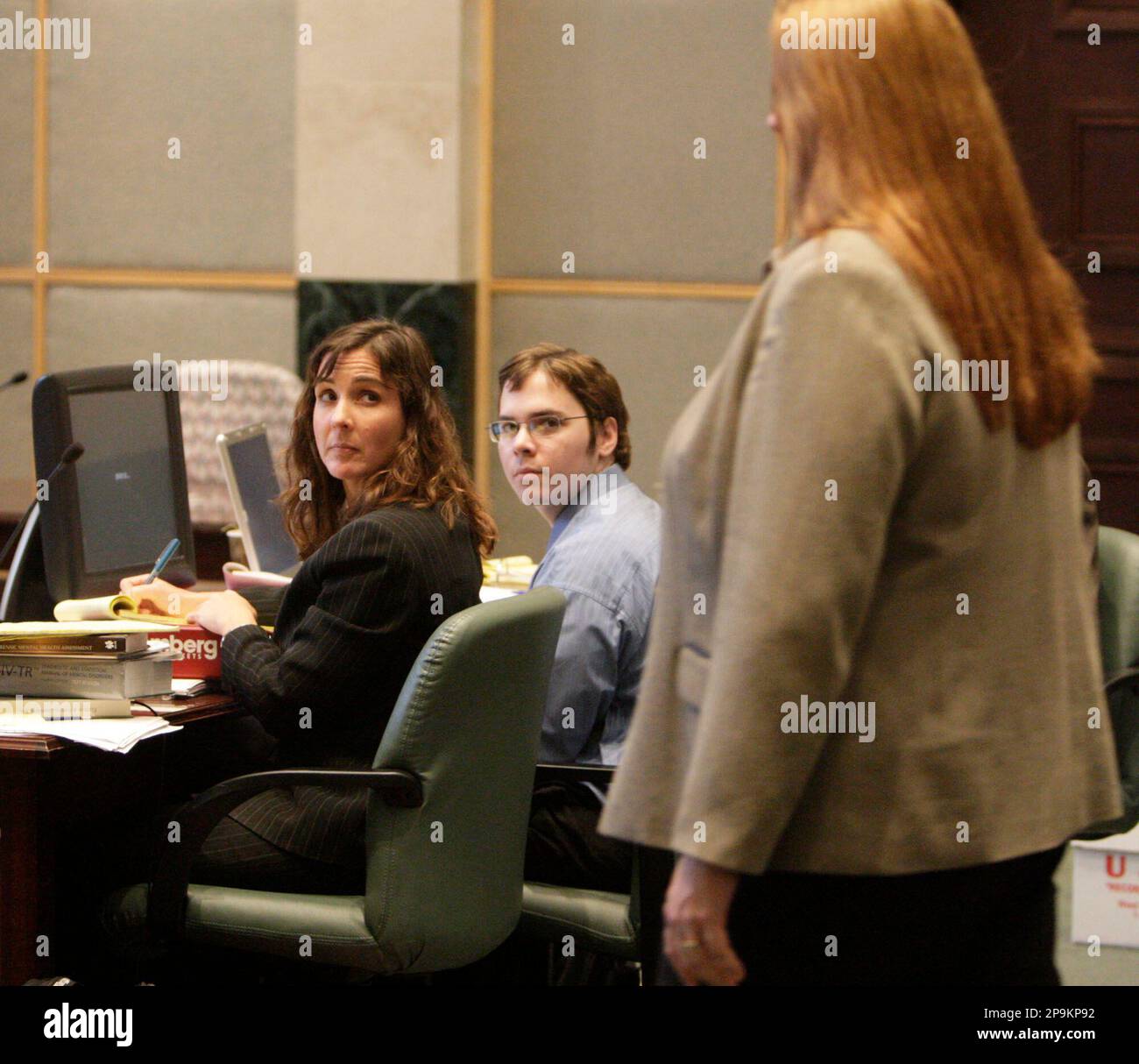 Defense attorney Lori Butts and defendant Michael Hernandez watch as ...