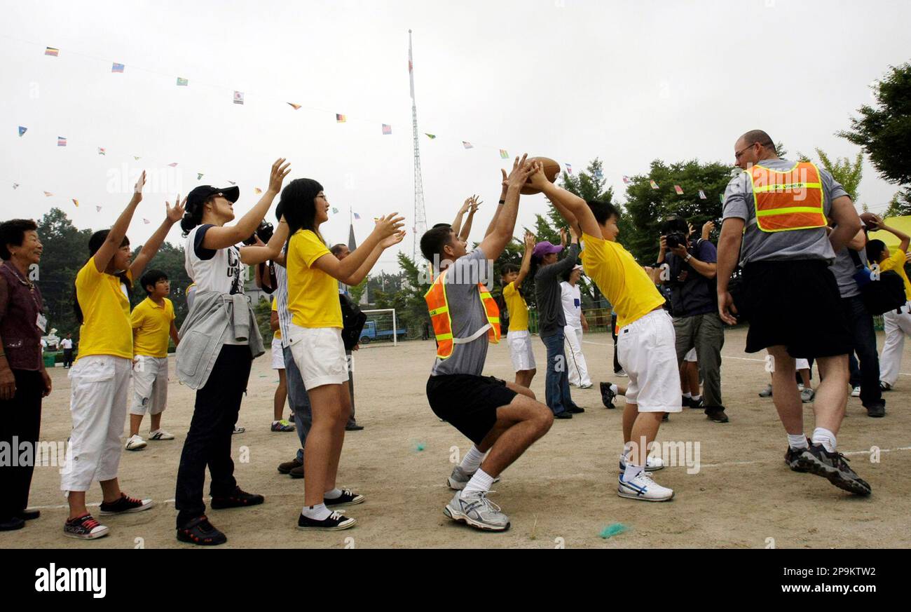 South Korea's Taesungdong elementary school students participate in ...