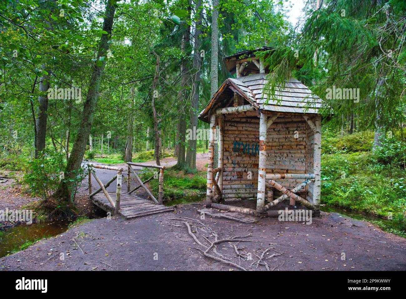 Birch booth shack and small bridge in the forest, Park Mon Repos ...